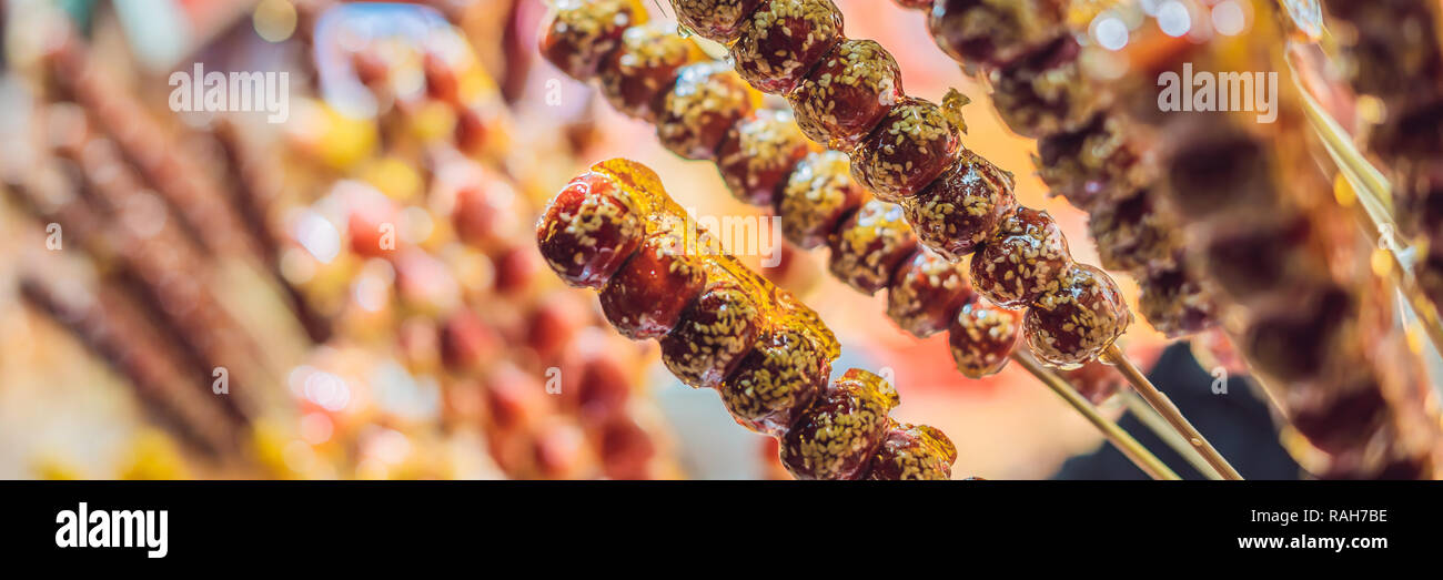 Chinese candied fruits and berries, Hawthorn and strawberries in sesame ...