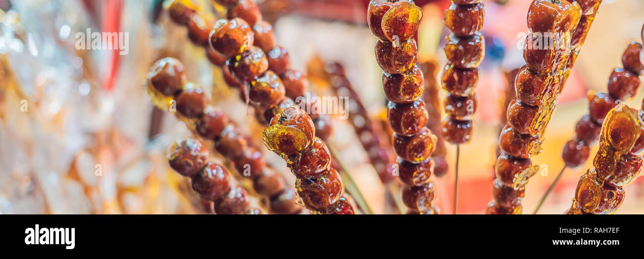 Chinese candied fruits and berries, Hawthorn and strawberries in sesame ...