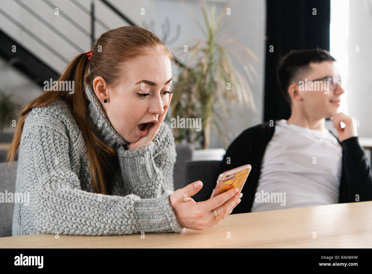 SMS. Closeup portrait funny shocked anxious scared young girl looking ...