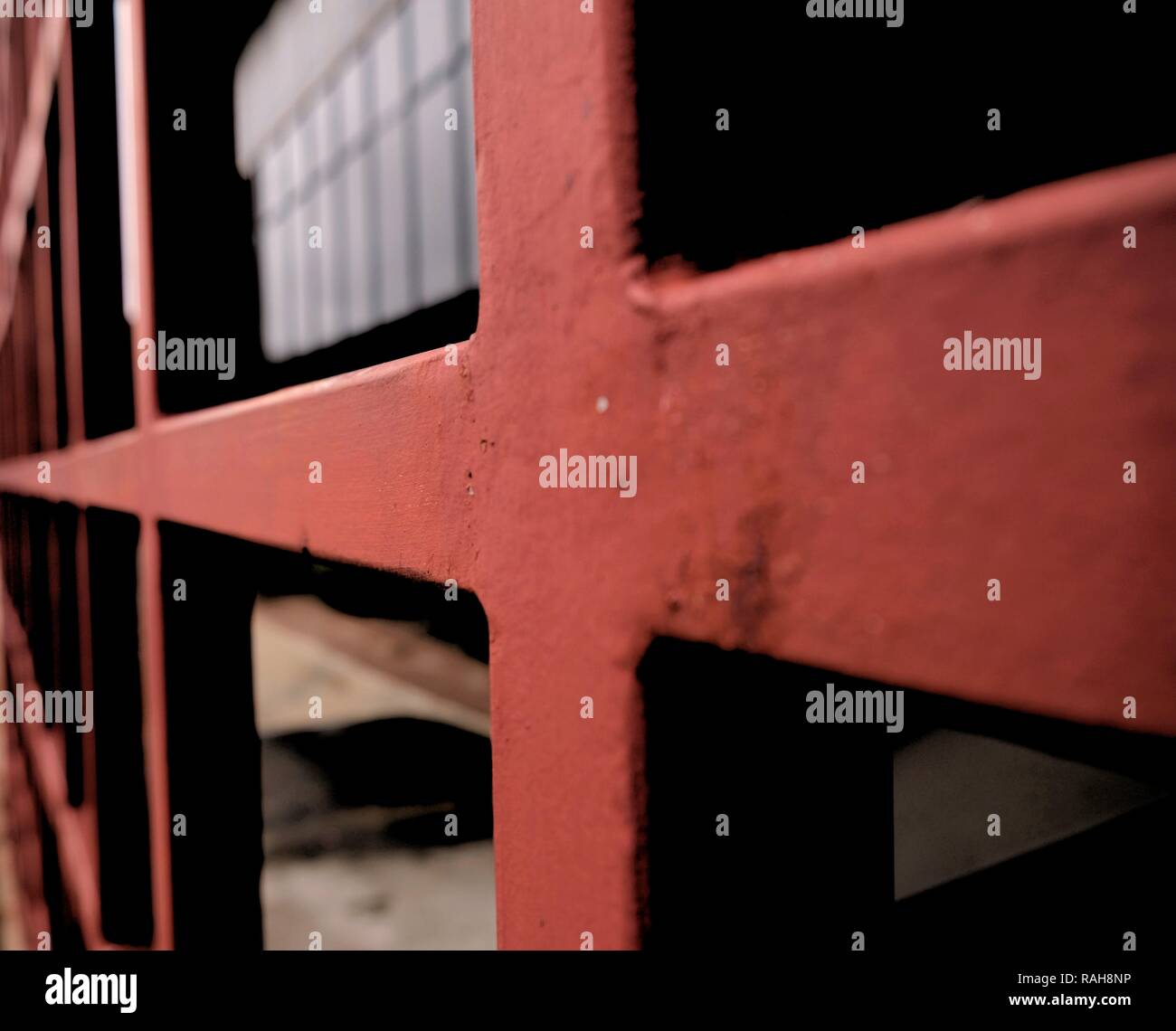Close-up of a red metal square pattern; exterior design element at an ...