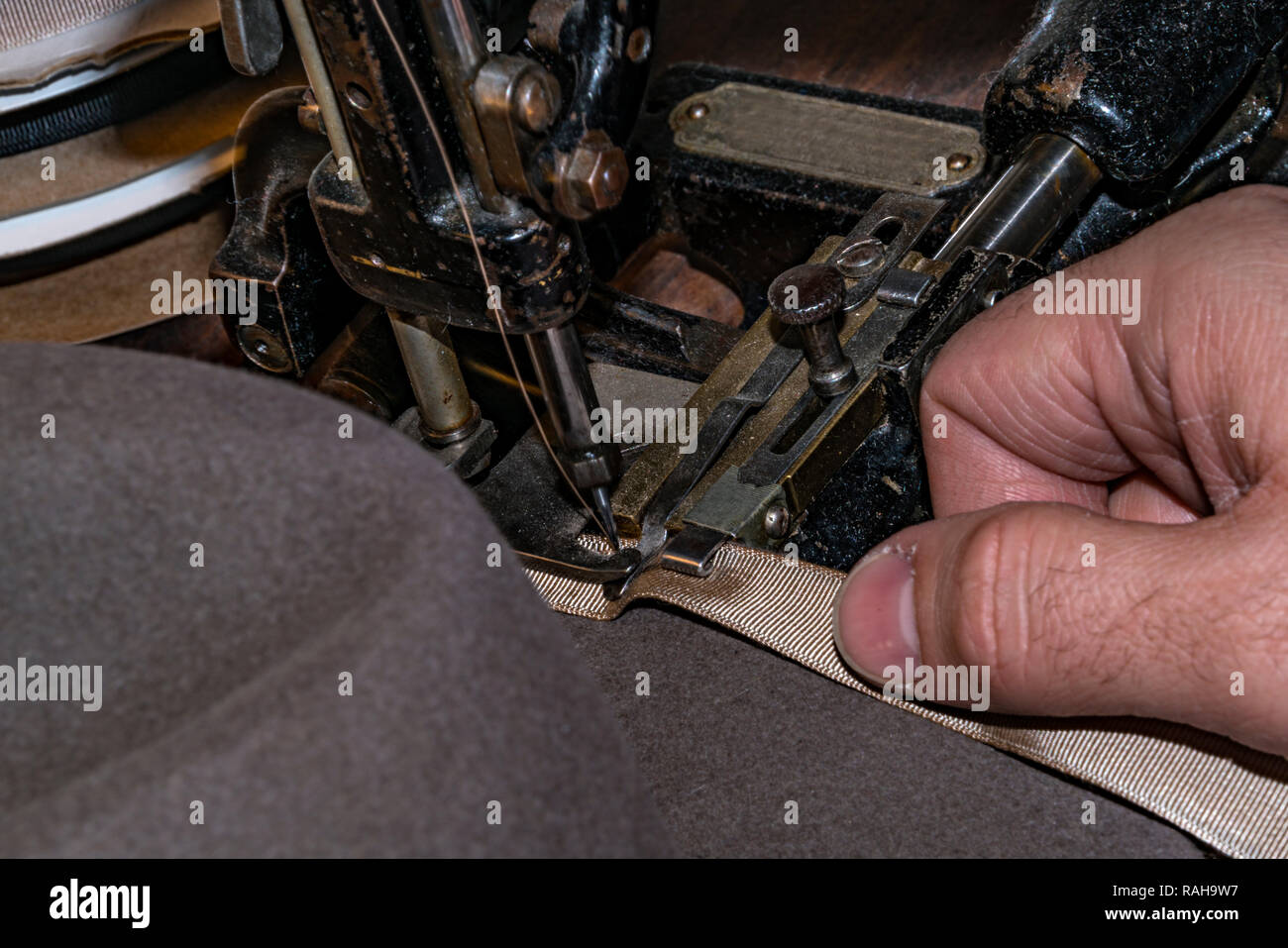 Hat Maker at Work, hands sewing Stock Photo - Alamy