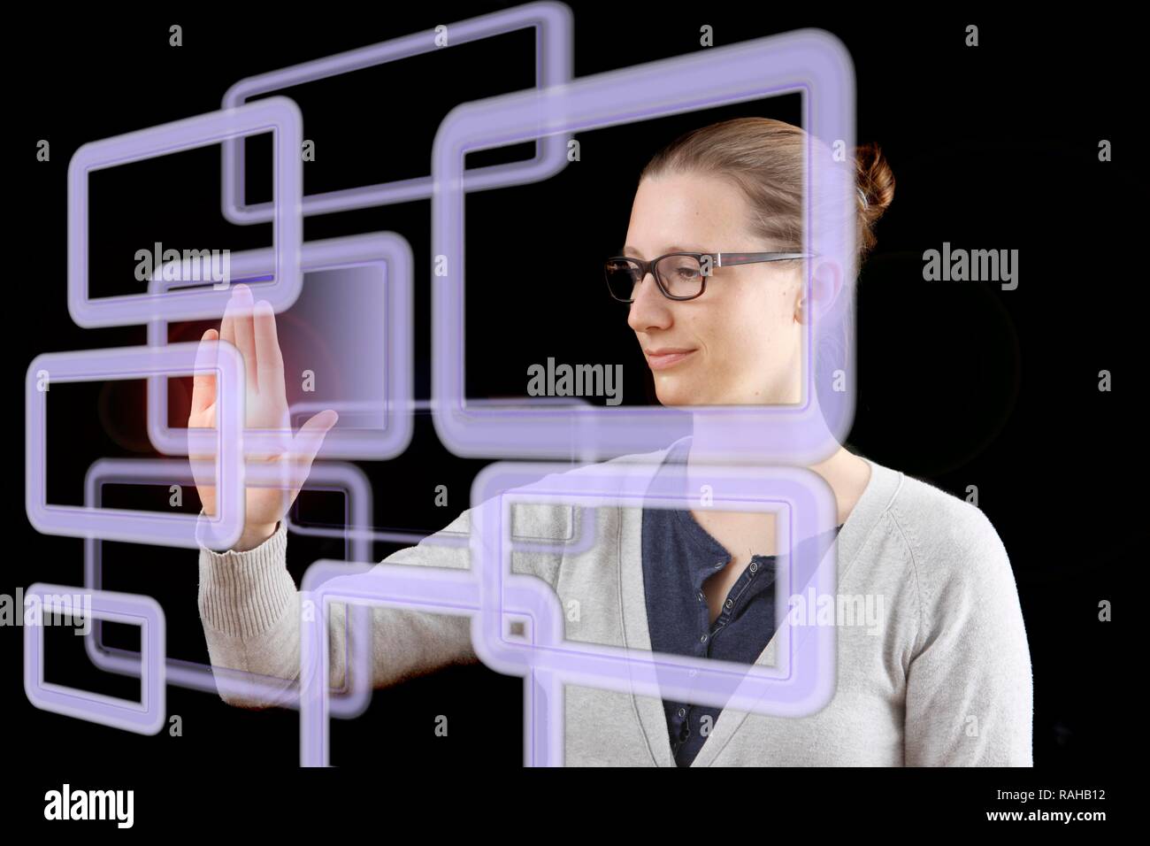 Woman using virtual icons, interactive user interface, symbolic image ...