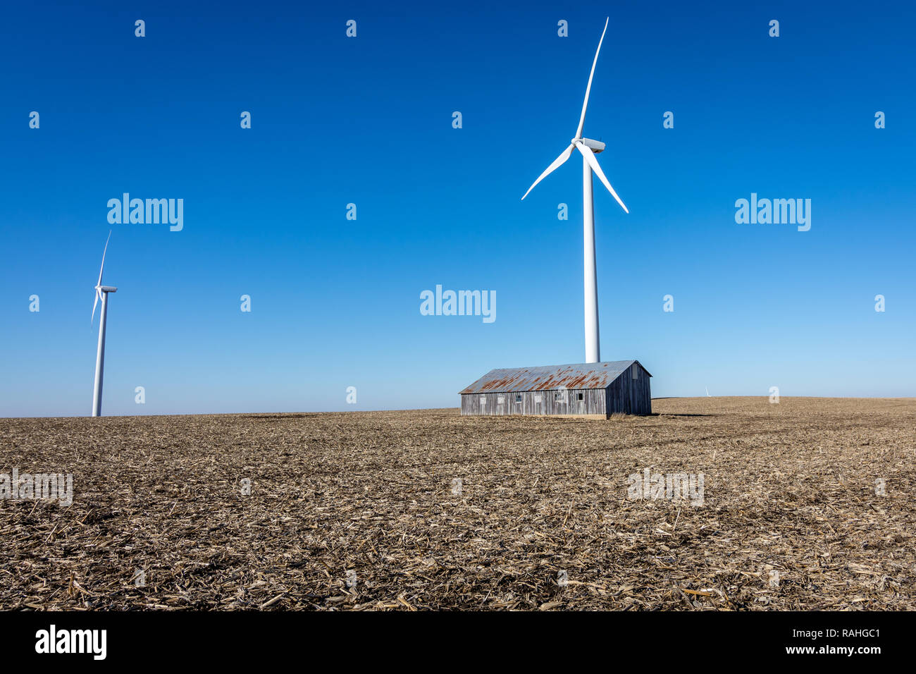 Wind turbine and isolated farm building in rural Illinois on a cold ...