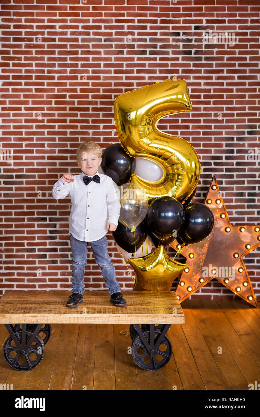 Beautiful kids, little boys celebrating birthday and blowing candles on ...