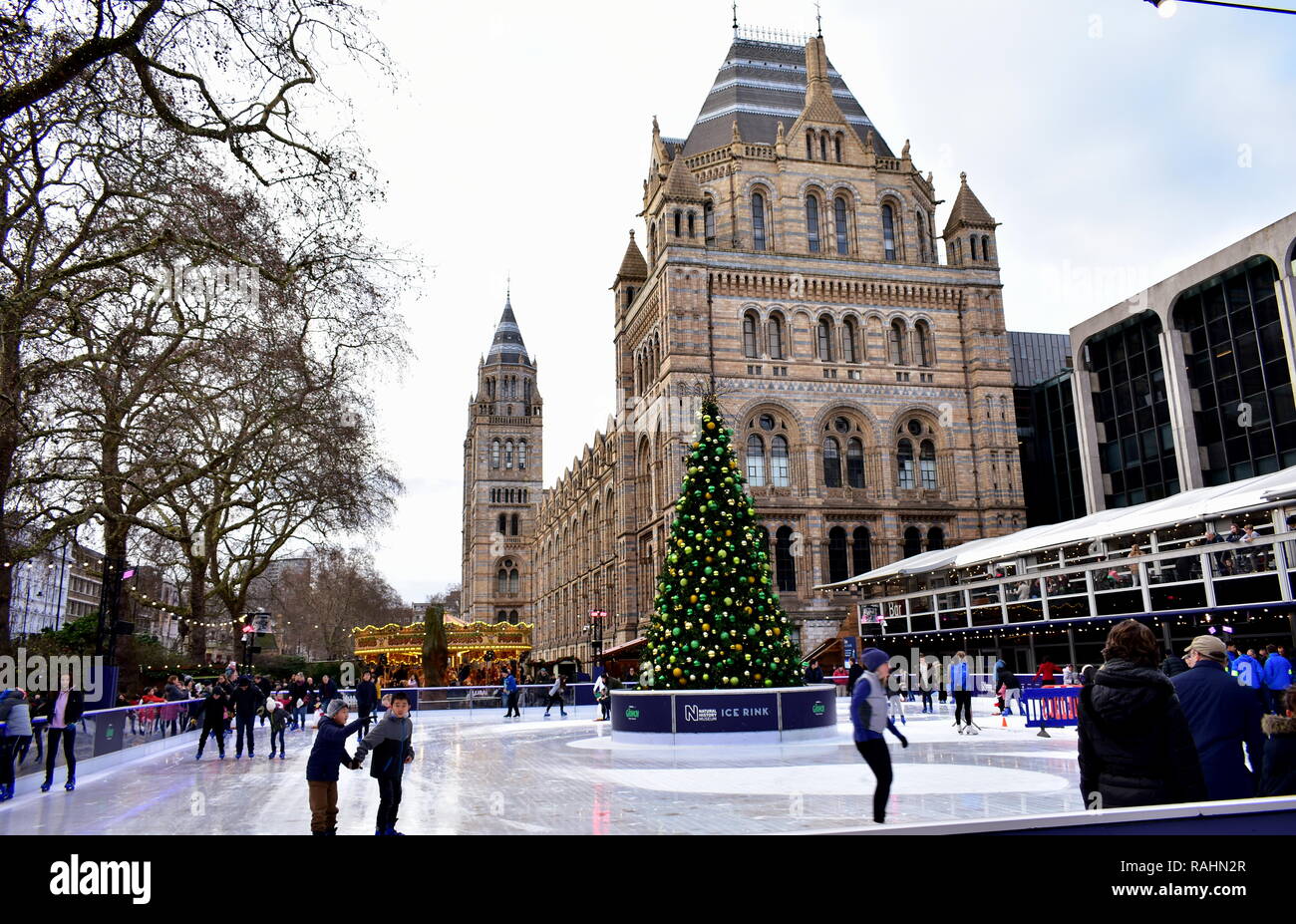 People skating on ice at the Natural History Museum Christmas Ice Rink ...