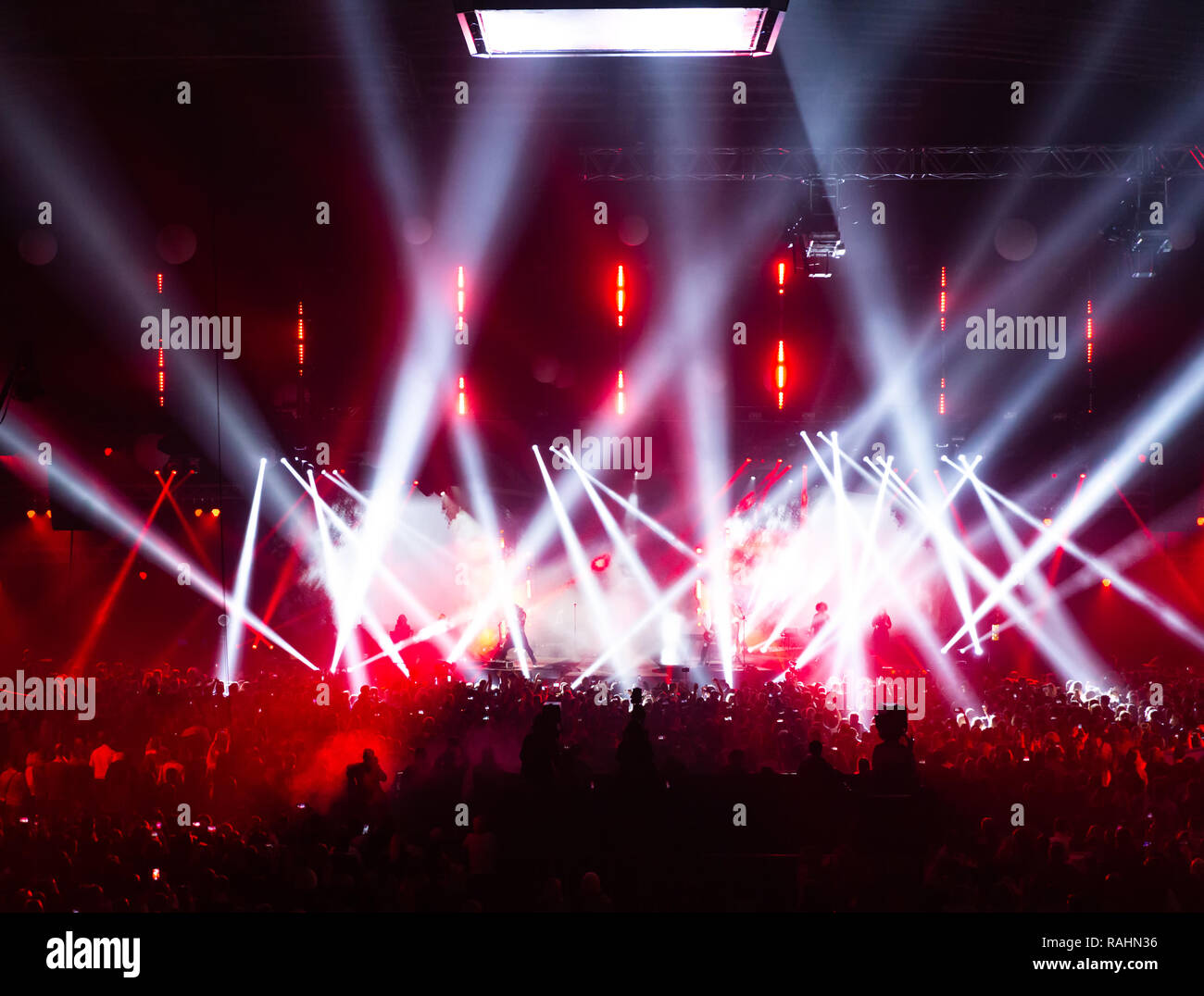 Concert crowd having fun at a rock concert. Large concert hall with a ...