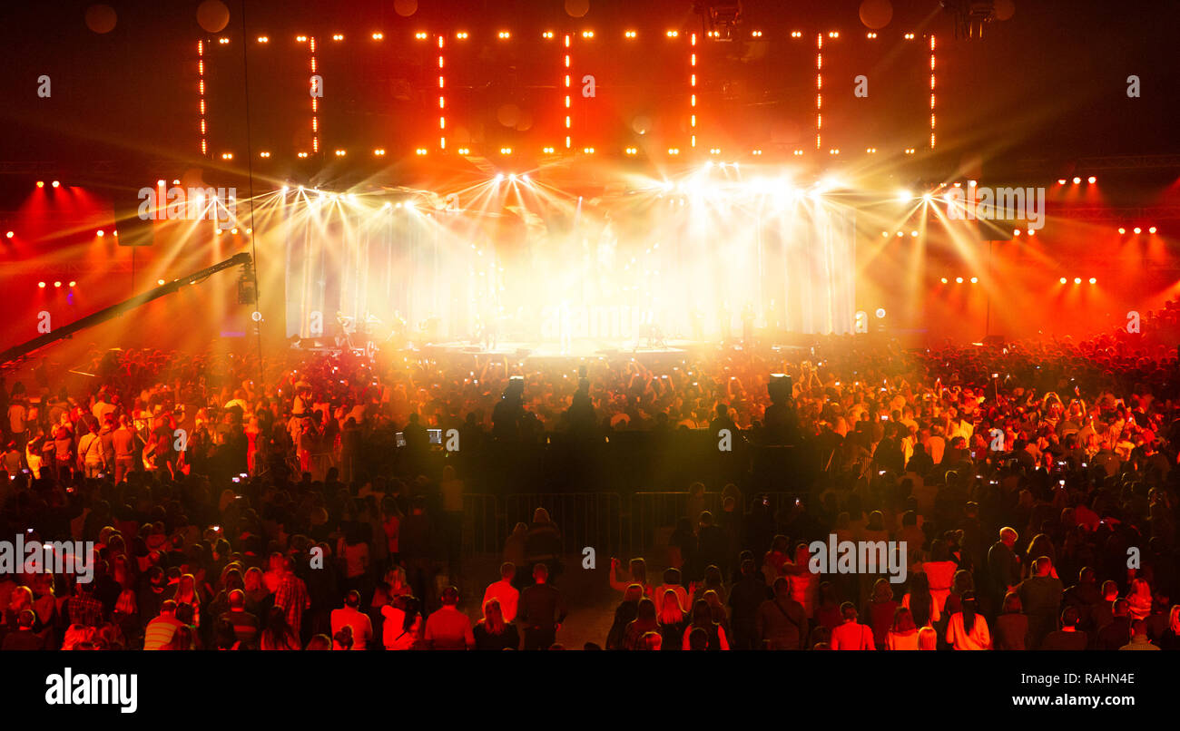 Concert crowd having fun at a rock concert. Large concert hall with a ...