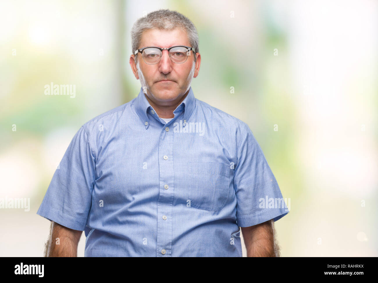 Handsome senior man wearing glasses over isolated background with ...