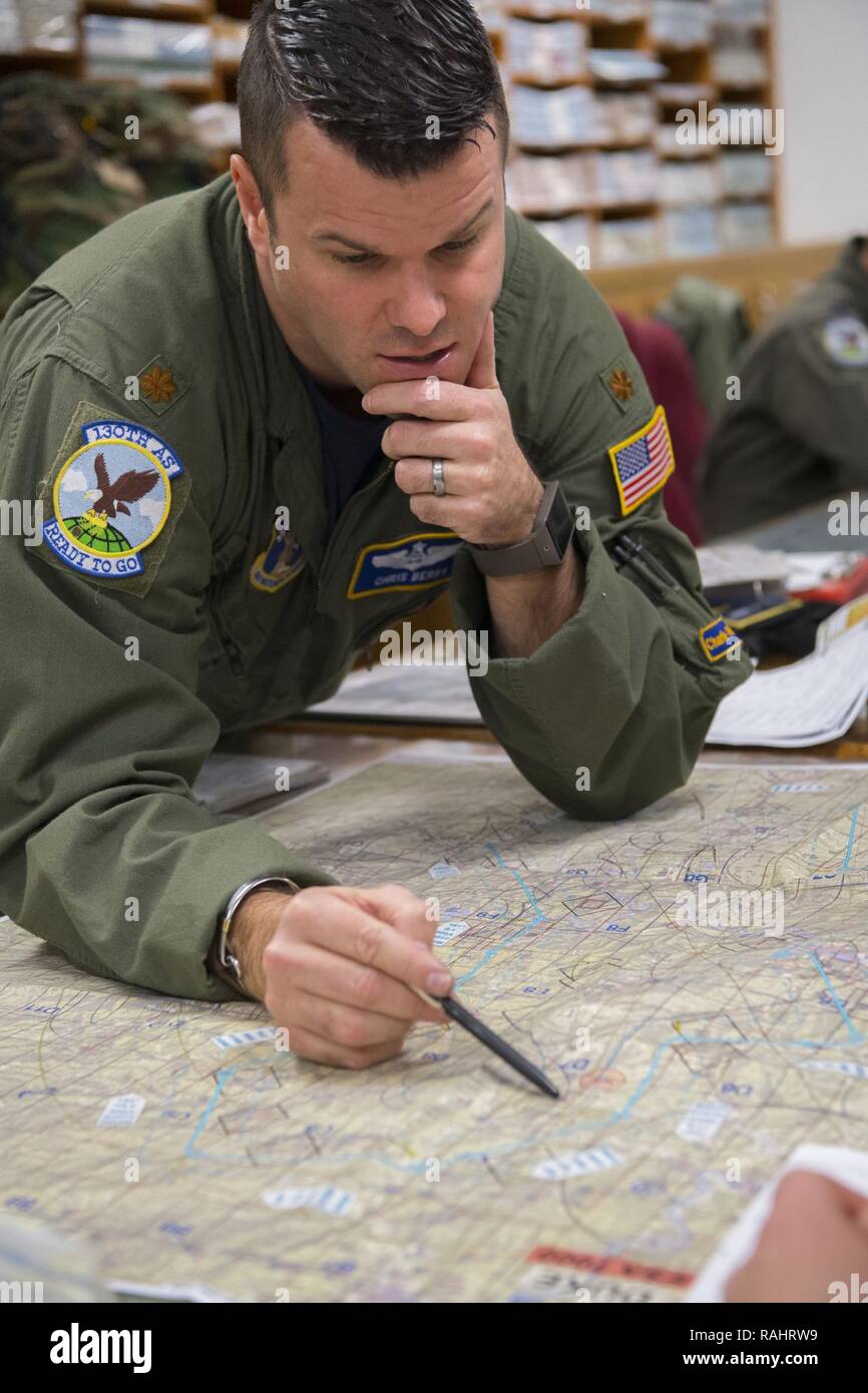 Maj. Chris Berry, 130th Airlift Wing navigator, reviews the flight path ...