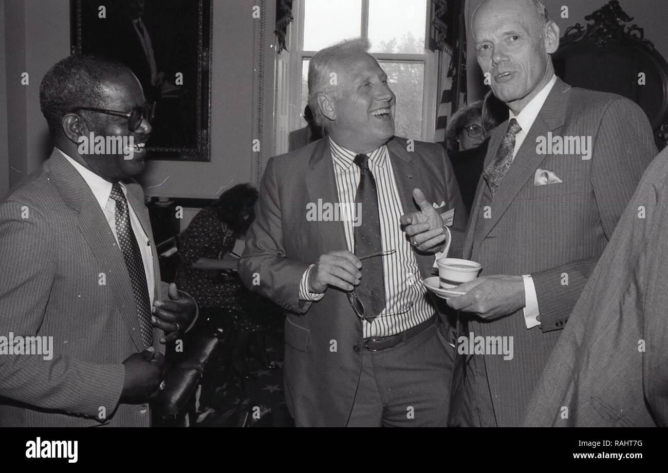 THREE MEN ARE GREETING EACH OTHER Stock Photo - Alamy