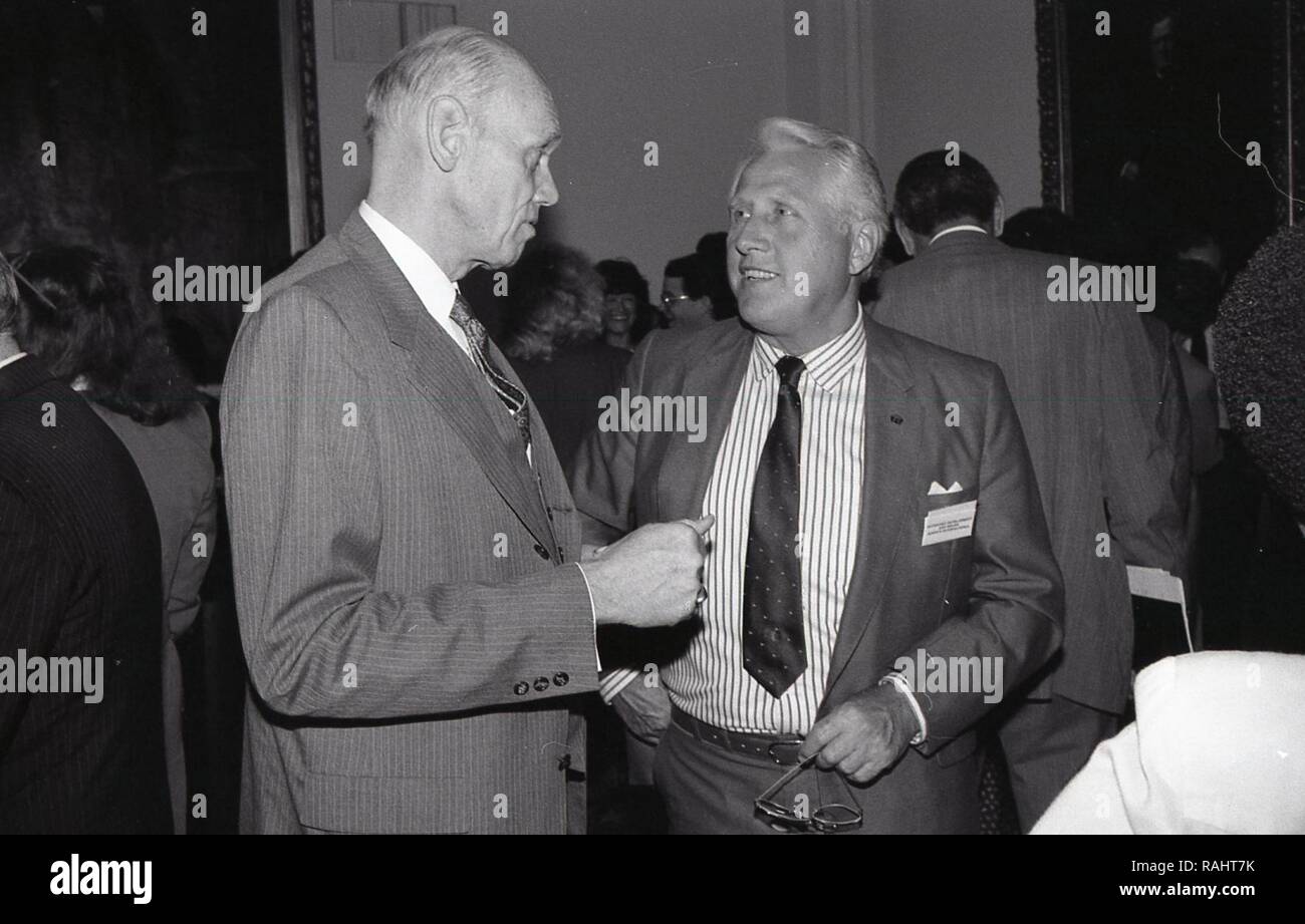 TWO MEN ARE HAVING A CONVERSATION Stock Photo - Alamy