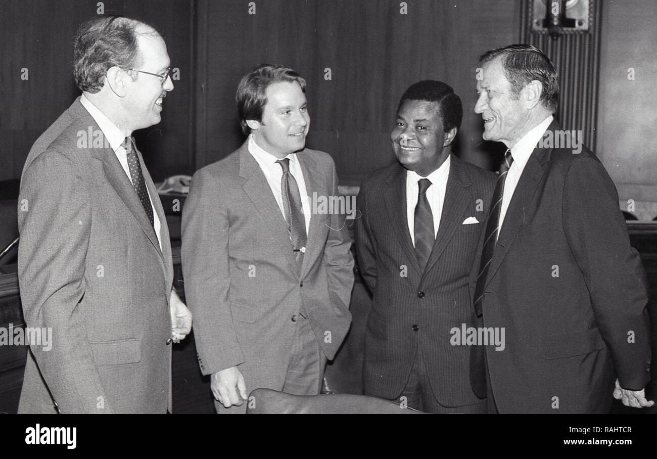 FOUR MEN ARE HAVING A CONVERSATION Stock Photo - Alamy