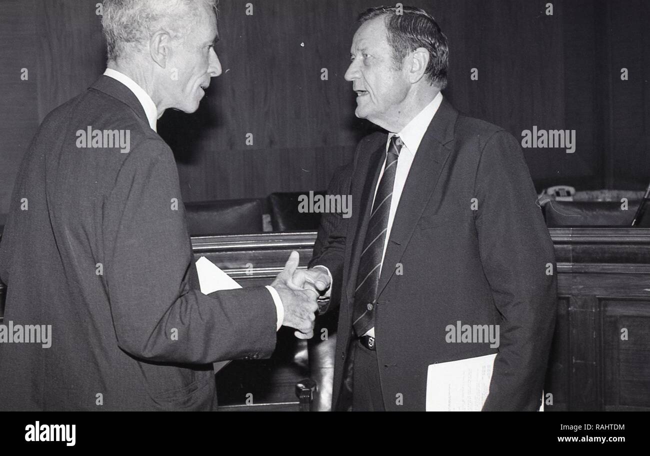 TWO MEN ARE GREETING EACH OTHER Stock Photo - Alamy