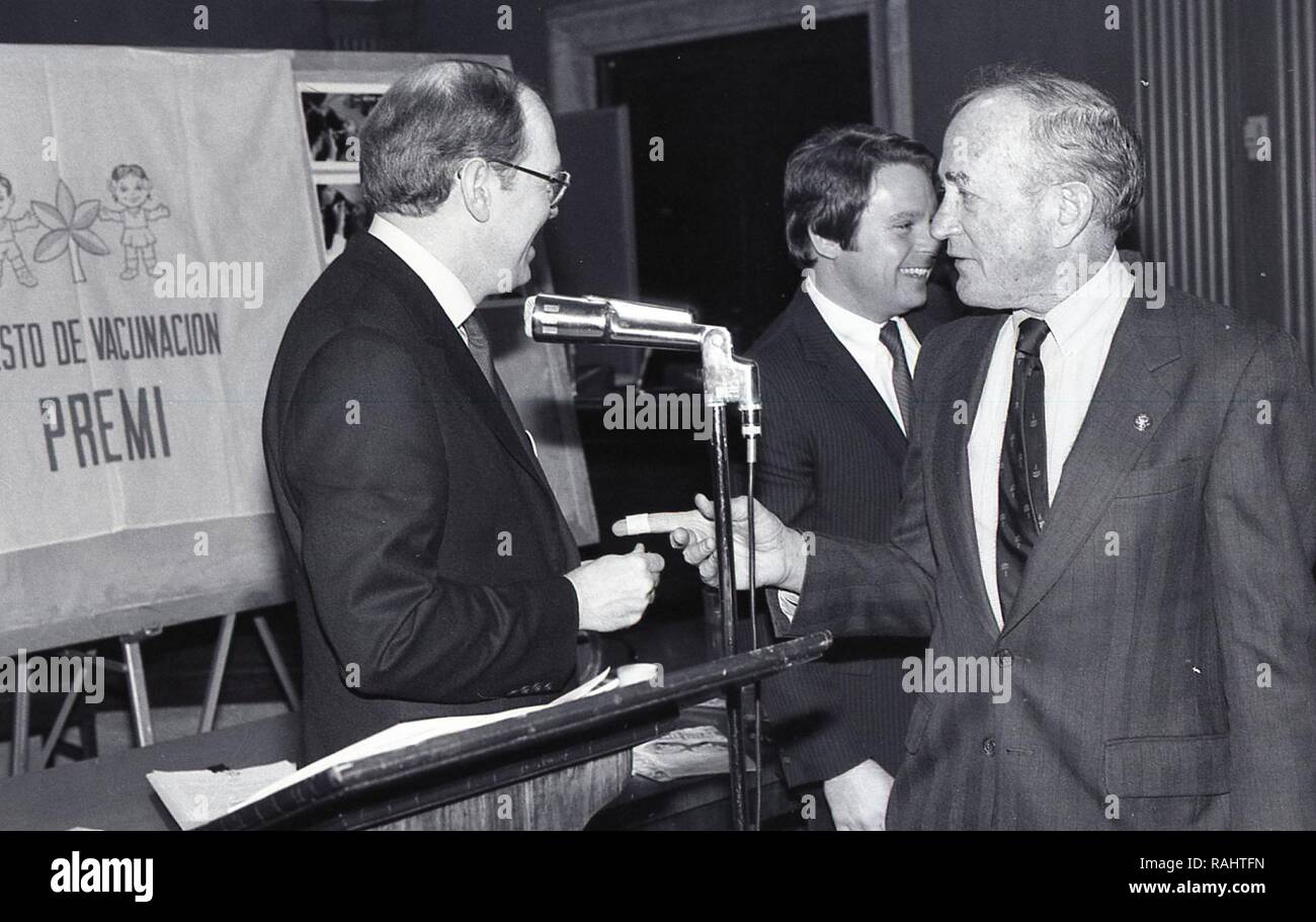 TWO MEN ARE AT THE PODIUM GREETING EACH OTHER Stock Photo - Alamy