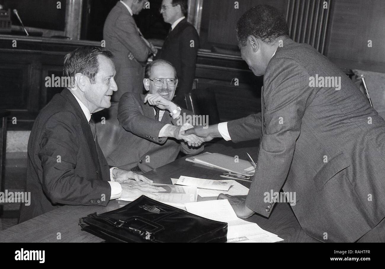 THREE MEN ARE HAVING A CONVERSATION Stock Photo - Alamy
