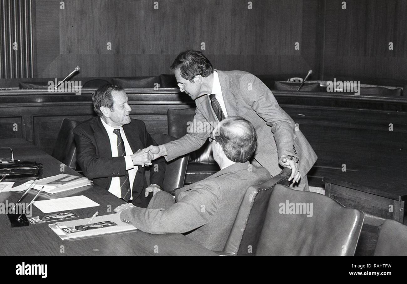 THREE MEN ARE HAVING A CONVERSATION Stock Photo - Alamy