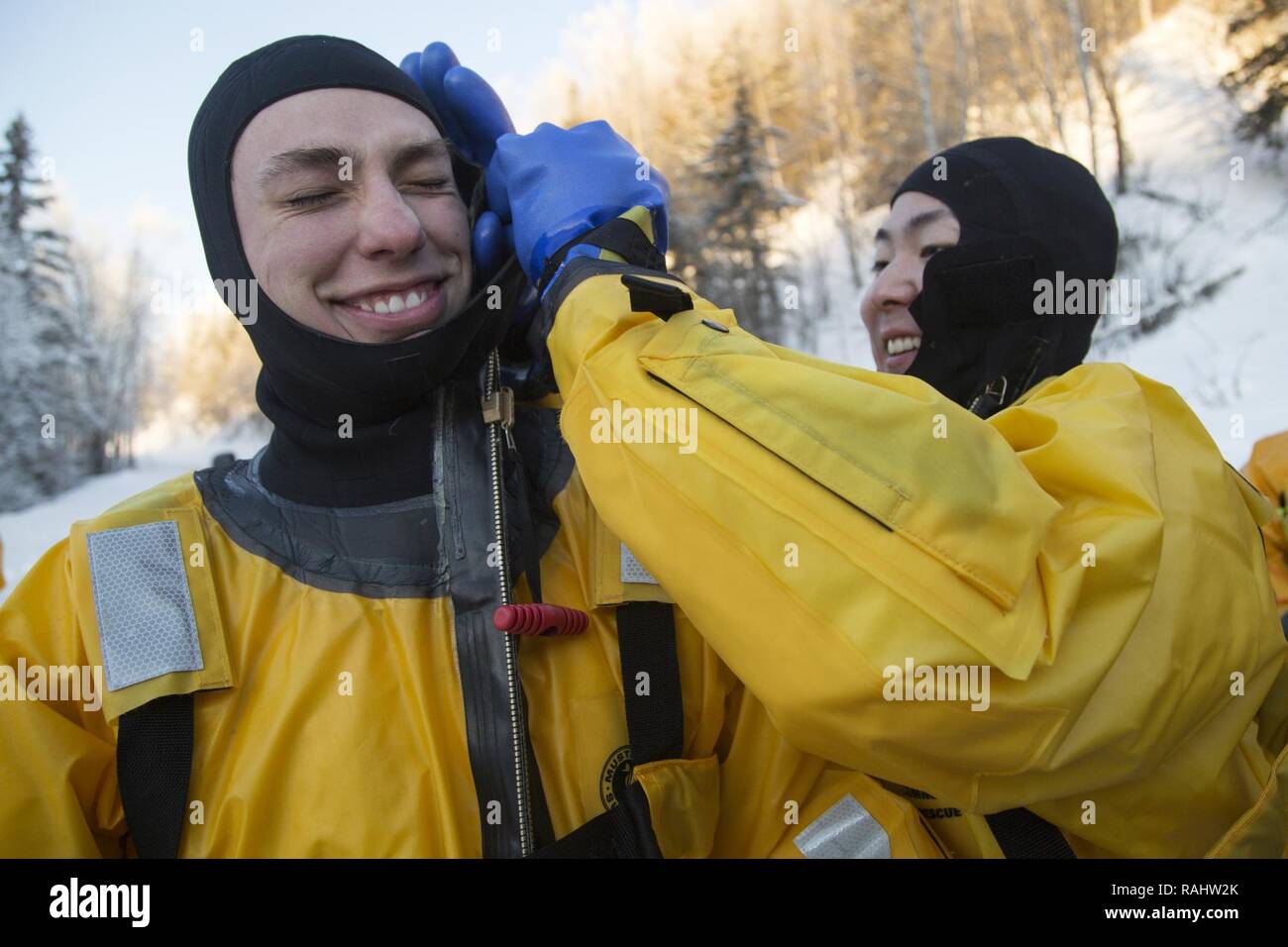 U.S. Air Force Senior Airman Joseph Pyun, right, assists Senior Airman ...