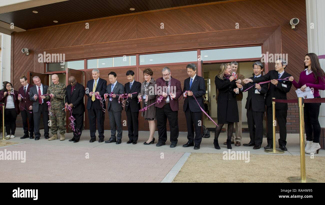 Students and staff, service members and civilian personnel cut ribbons ...
