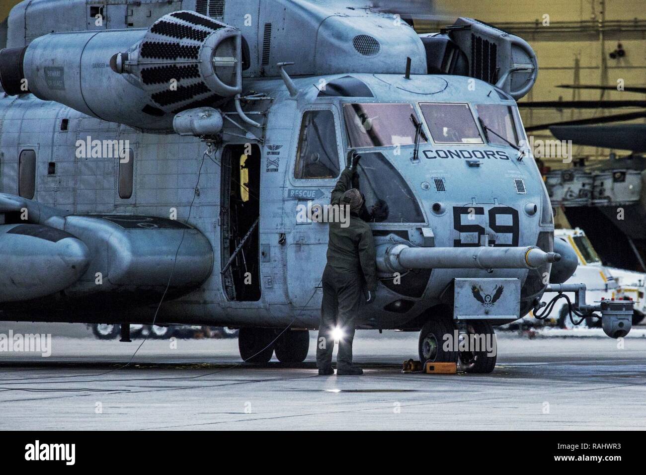 U.S. Marines with Marine Heavy Helicopter Squadron 464 prepare for a ...