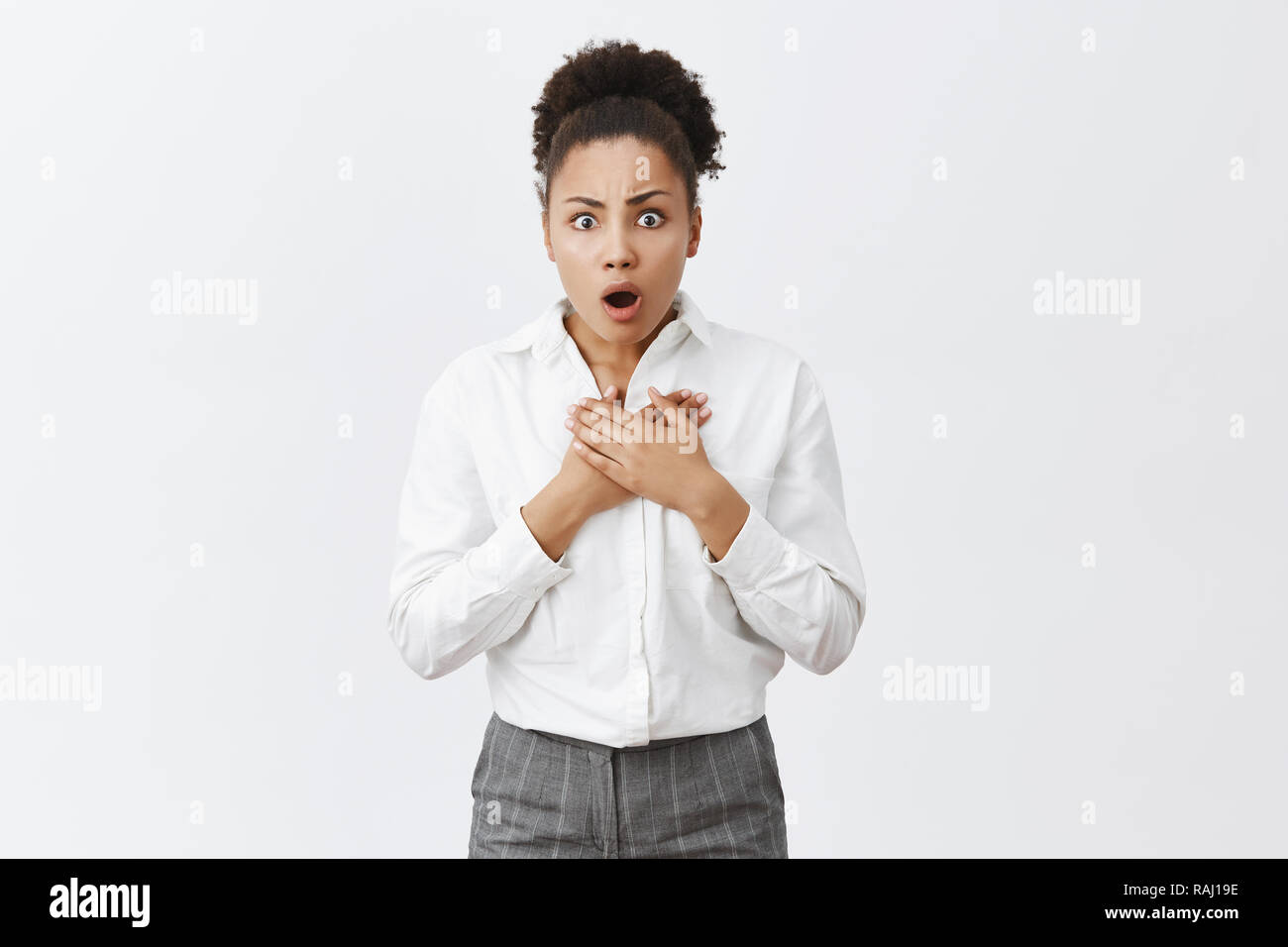Gosh, oh no. Portrait of shook and intense shocked woman with dark skin ...