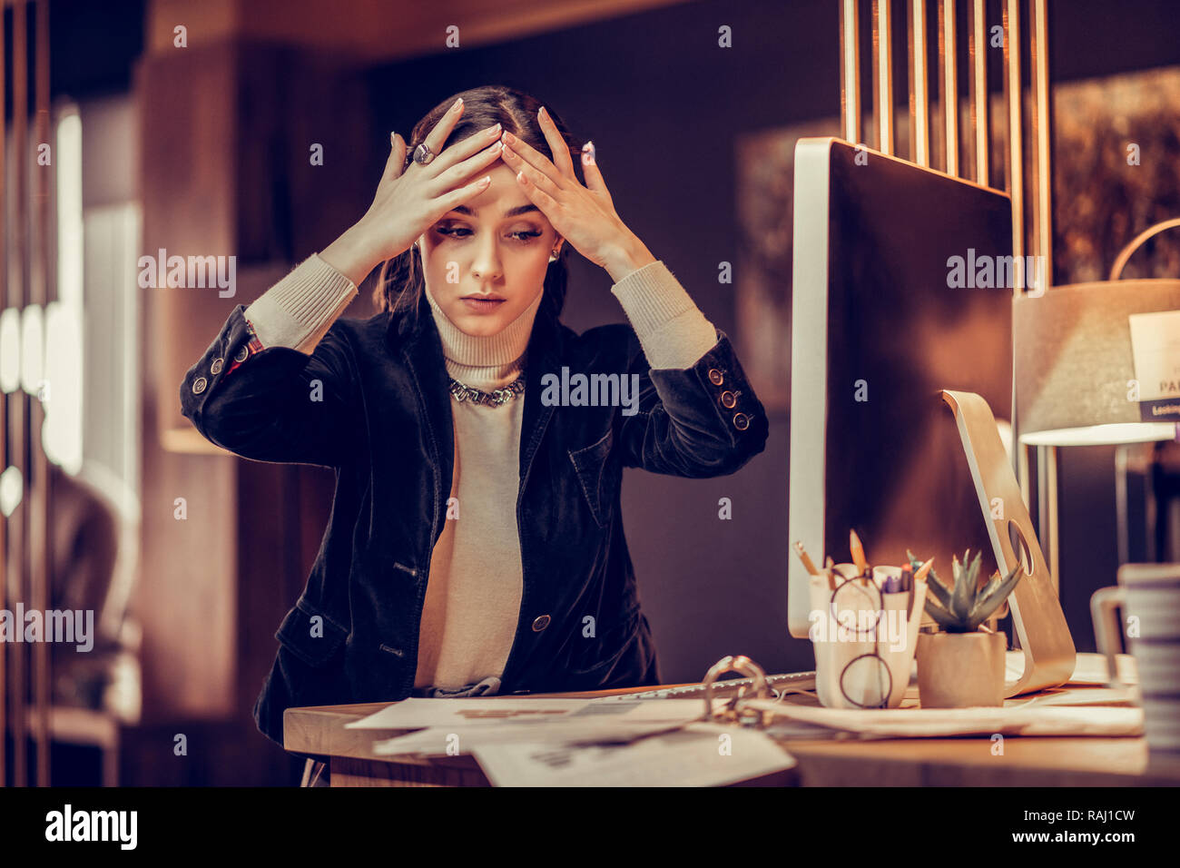 Frustrated young female person trying to concentrate Stock Photo - Alamy