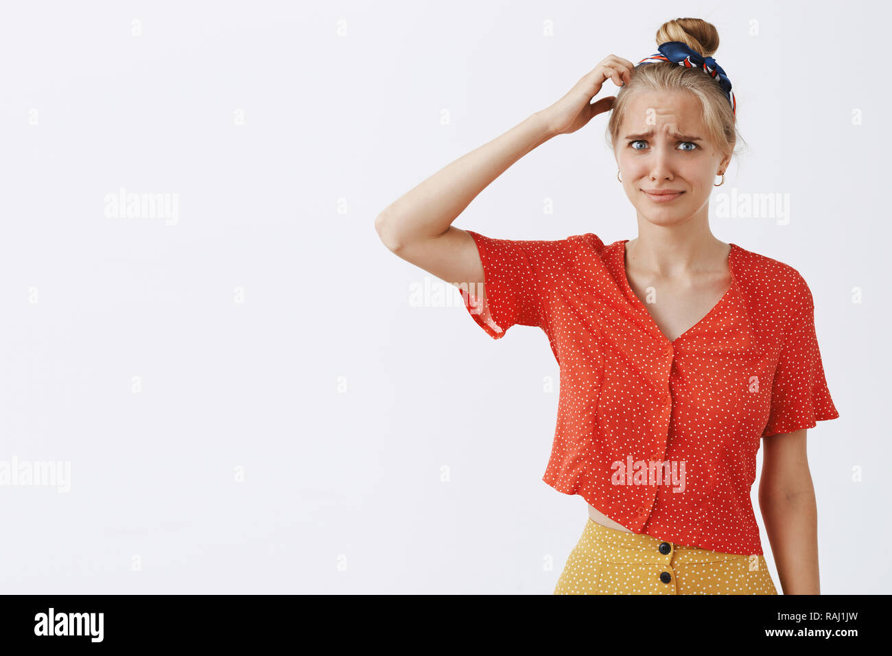 Woman scratching head young confused hi-res stock photography and ...