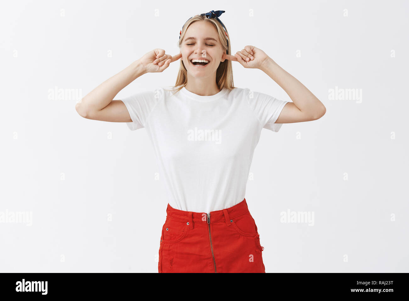 Plugging their ears hi-res stock photography and images - Alamy