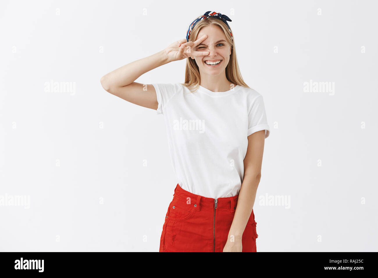Pretty blonde showing peace sign hi-res stock photography and images ...