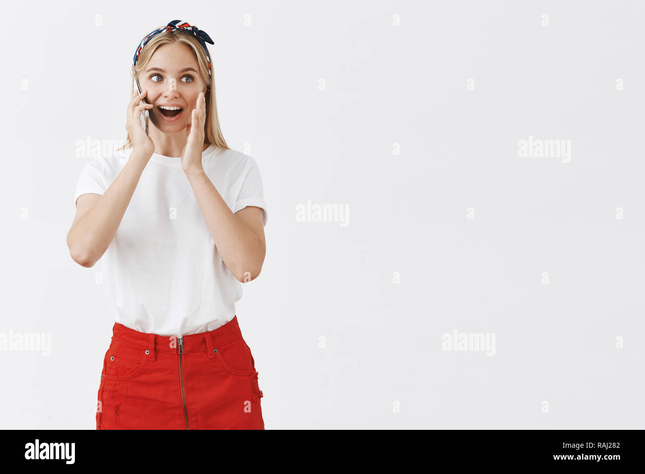 Studio shot of modern good-looking female freelancer standing in subway ...