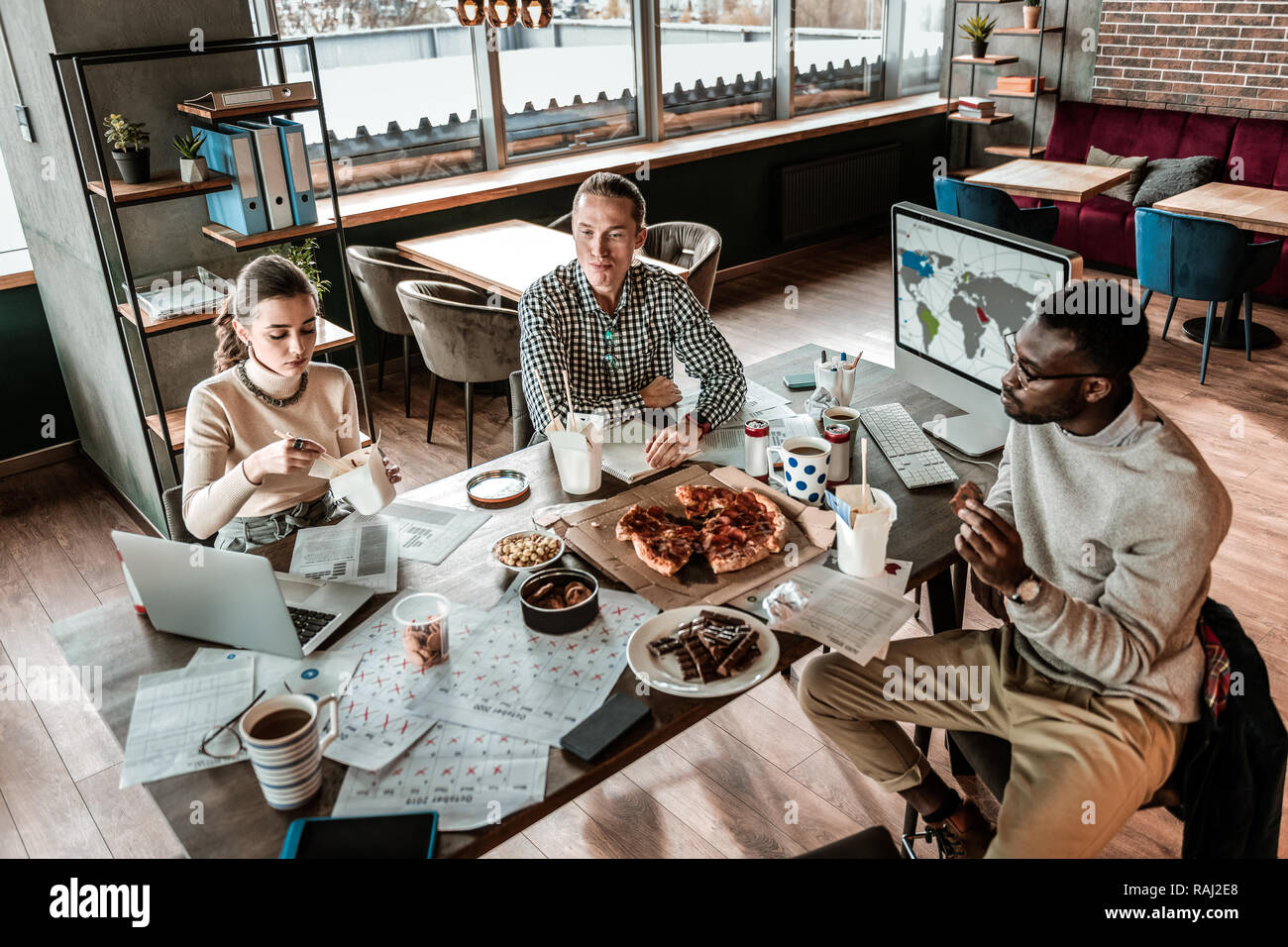 Group of young colleagues enjoying their dinner Stock Photo - Alamy