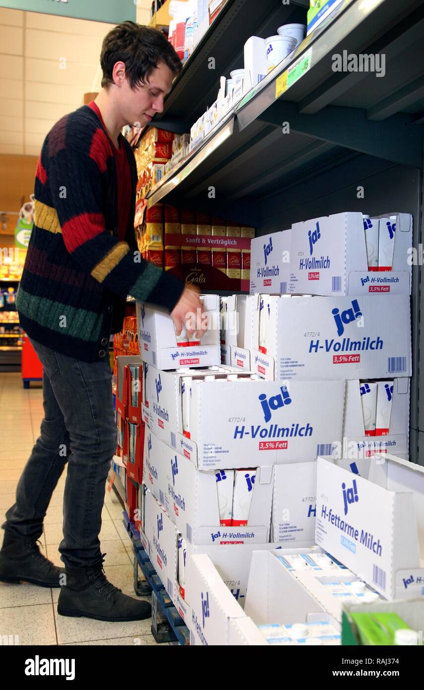 Man buying JA-brand long-life whole milk, food hall, supermarket Stock ...