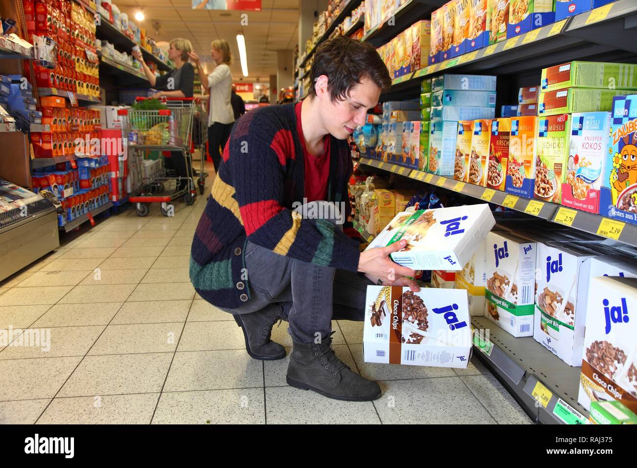 Man buying JA-brand Muesli, food hall, supermarket Stock Photo - Alamy