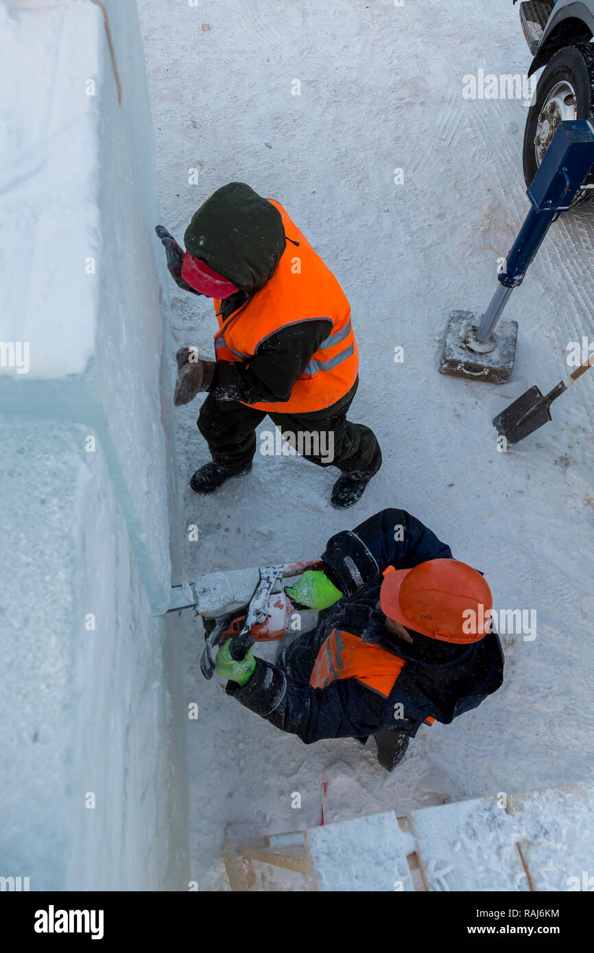 Installers are building an ice town of ice blocks Stock Photo - Alamy