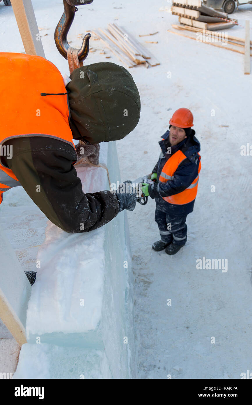 Installers are building an ice town of ice blocks Stock Photo - Alamy