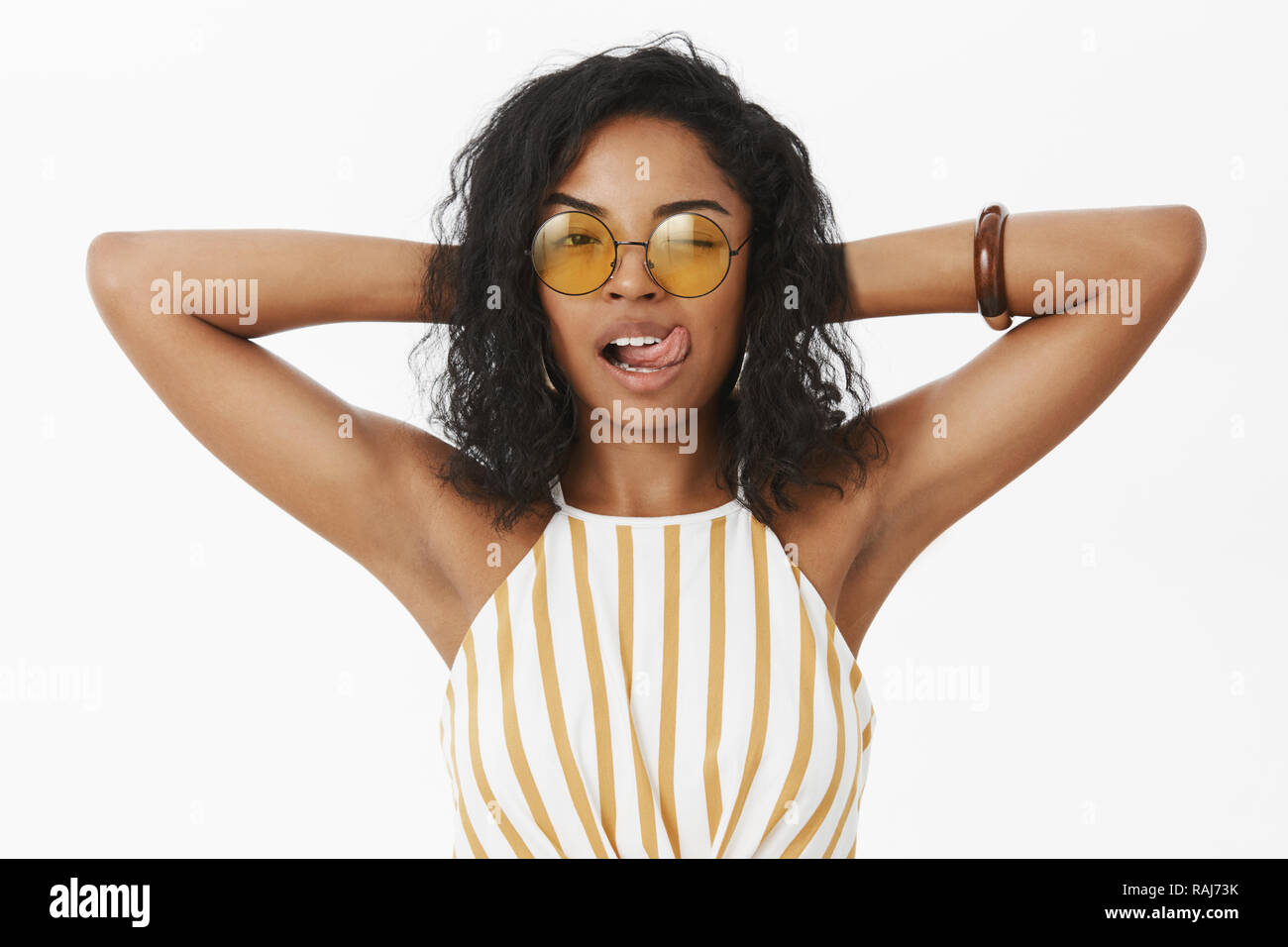 Flirty feminine and stylish confident african american female in trendy ...