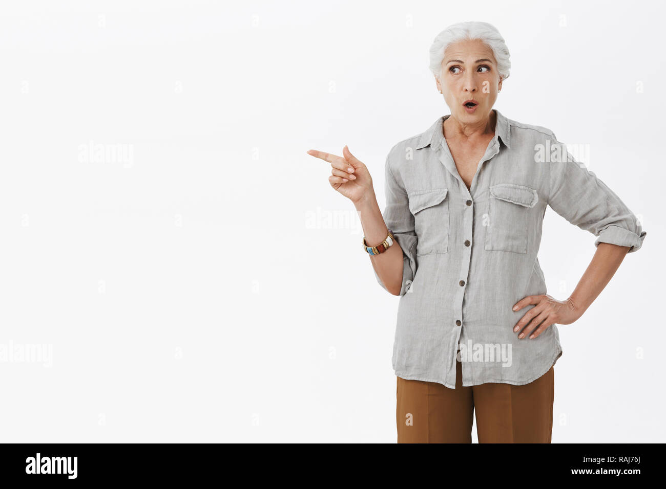 Portrait of stunned intense and questioned grandmother with gray hair ...