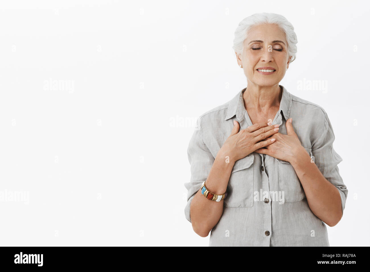 Recalling memories of past. Portrait of charmed cute and calm relieved ...