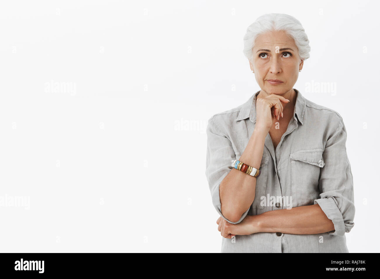 Waist-up shot fo concerned woman thinking about kids. Portrait of ...