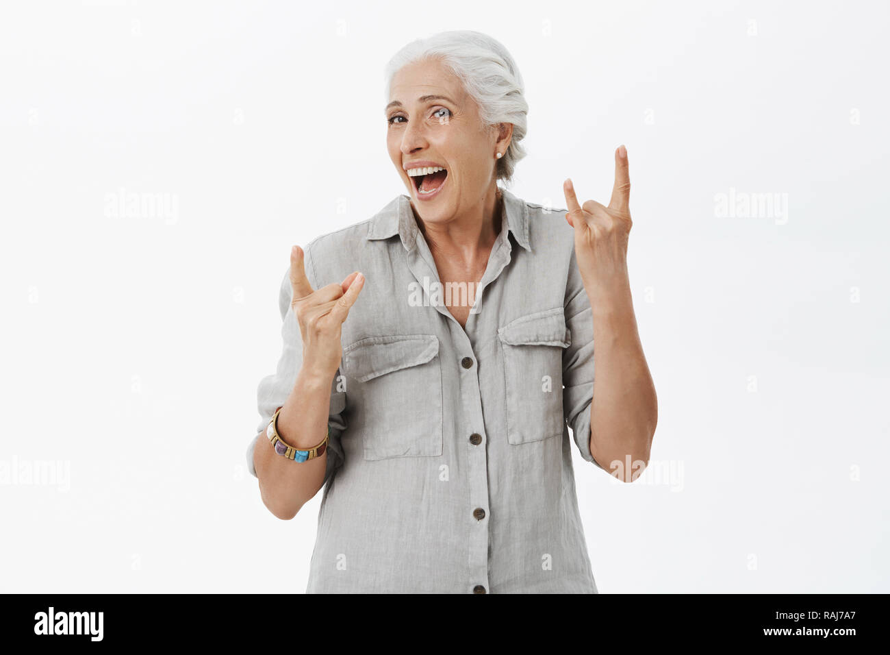 Waist-up shot of energized charismatic and happy old lady feeling like ...