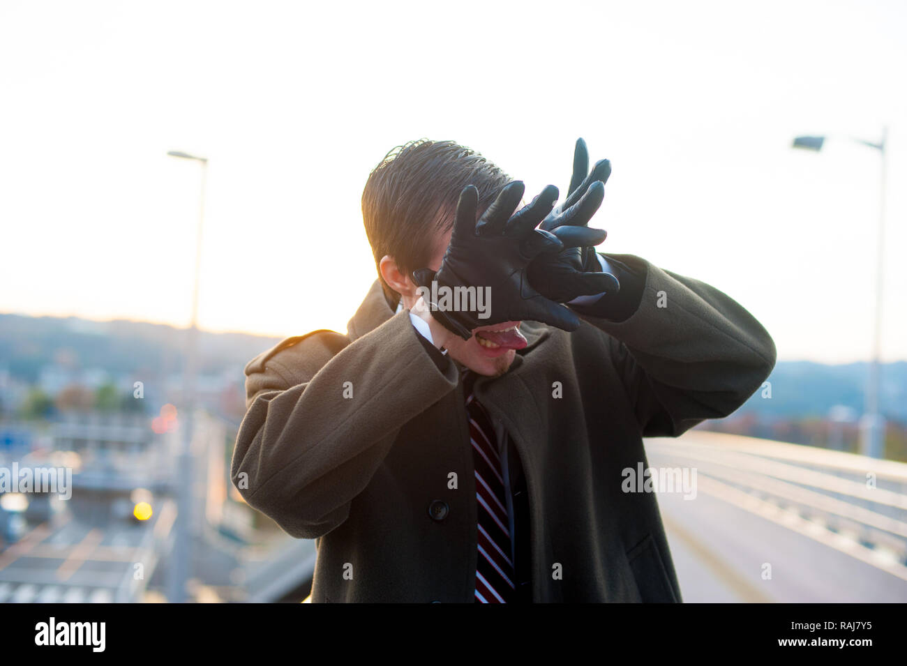Caucasian male model poses for pictures on the street Stock Photo - Alamy