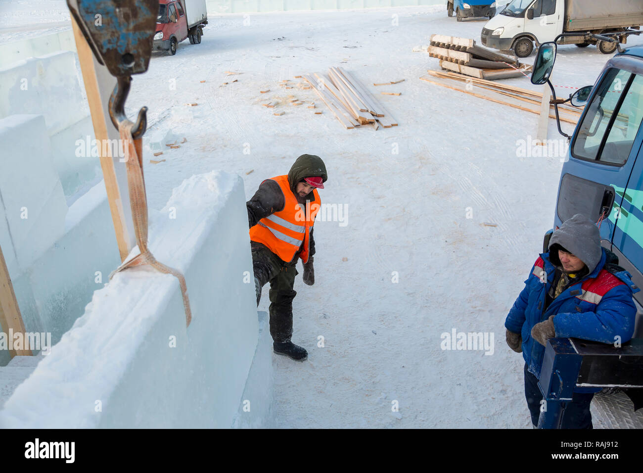 Installers are building an ice town of ice blocks Stock Photo - Alamy