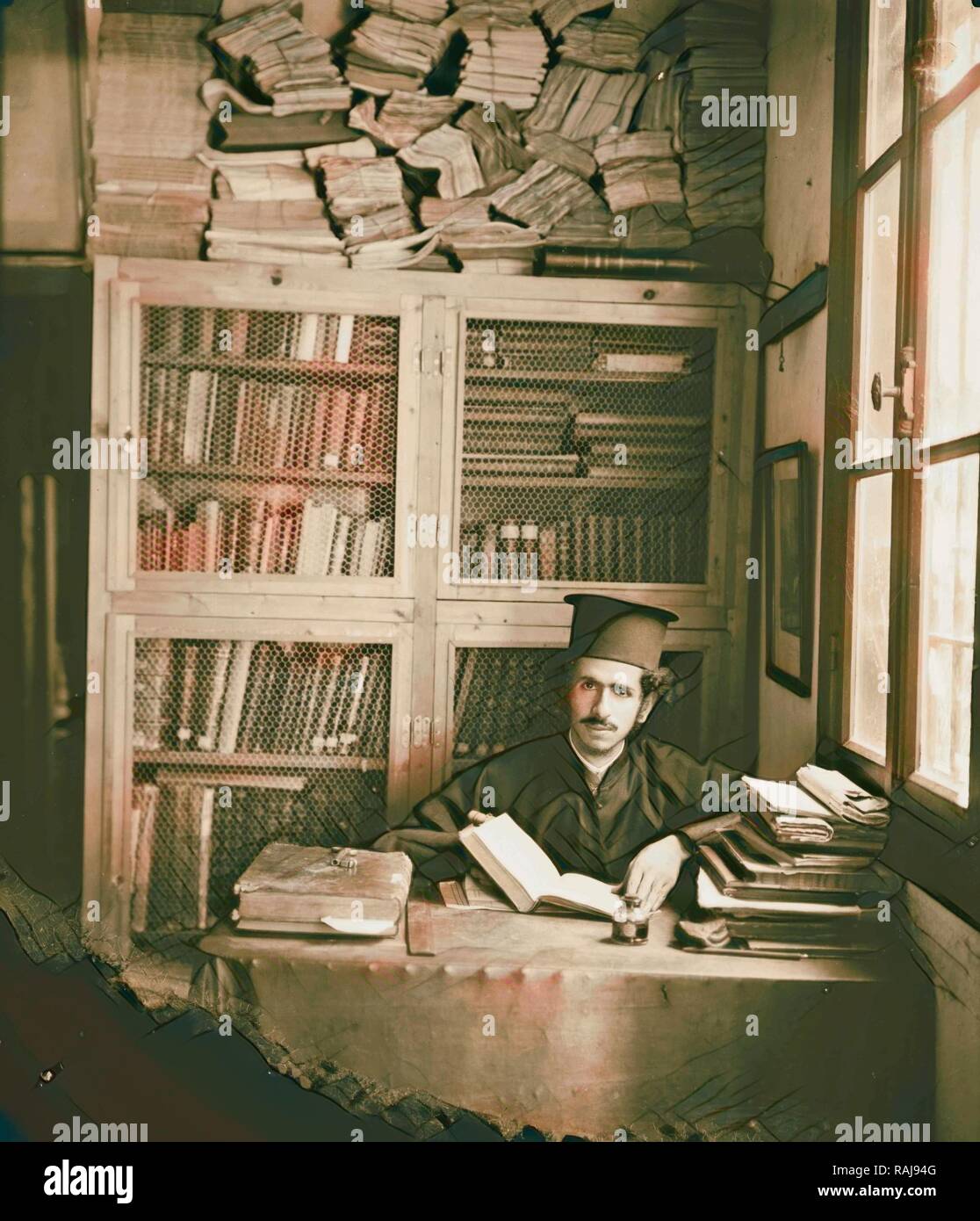 Greek Orthodox monk in a convent library presumably in Jerusalem. 1898 ...