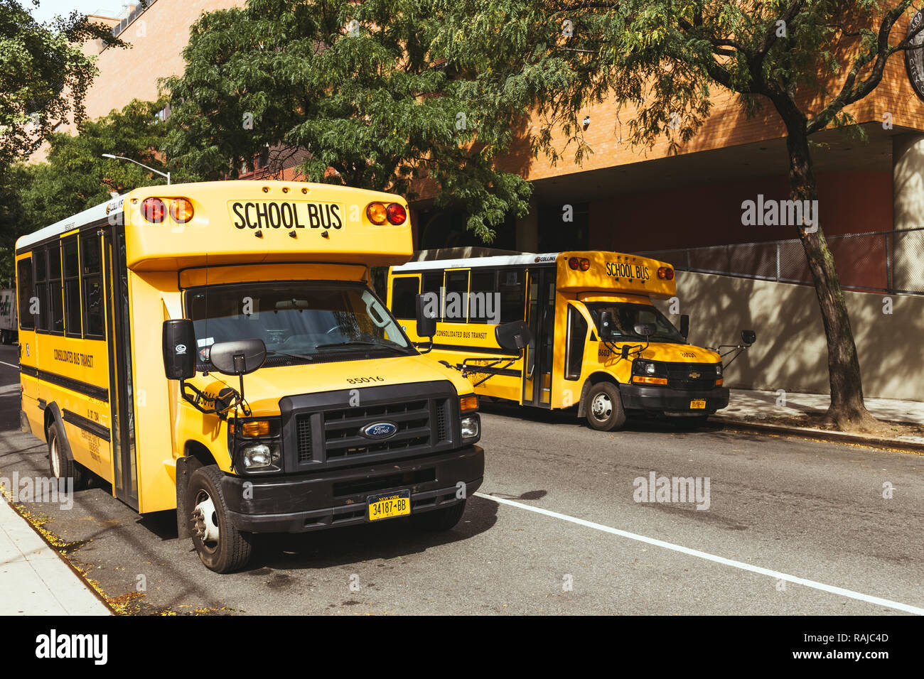 NEW YORK, USA - OCTOBER 8, 2018: yellow school buses parked on street ...