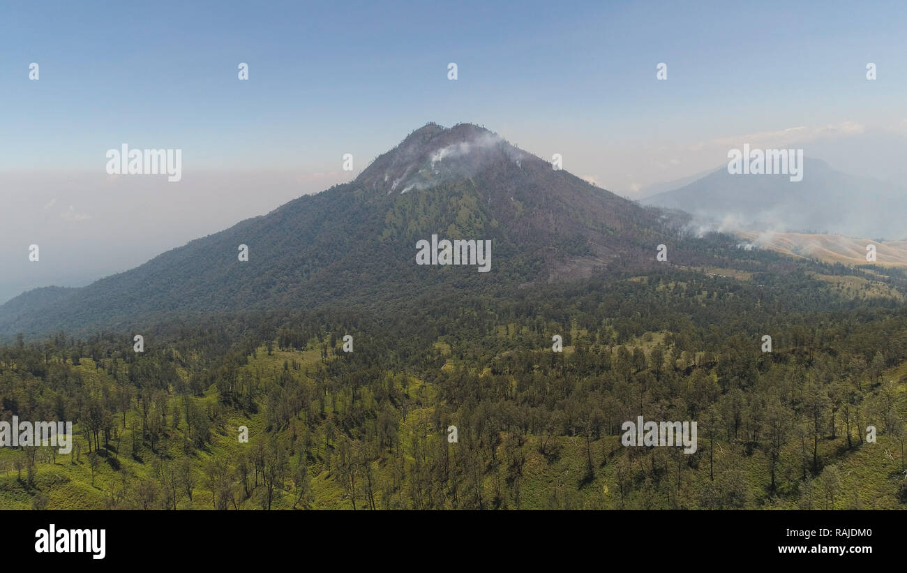 aerial view forest fire smoke on slopes hills. wild fire in tropical ...