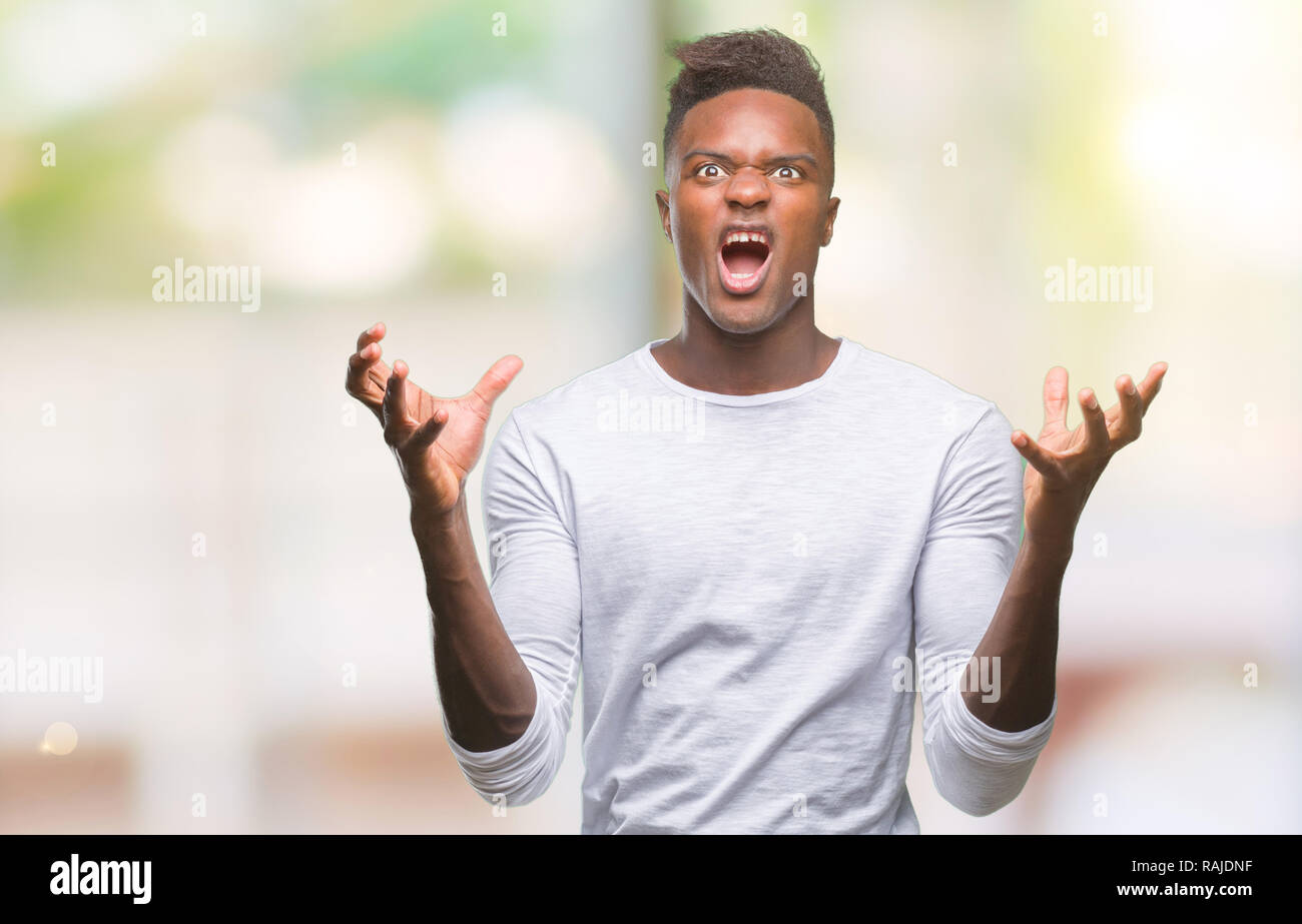 Young african american man over isolated background crazy and mad ...