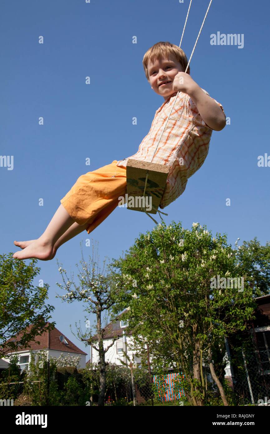 6 year old boy swings hi-res stock photography and images - Alamy