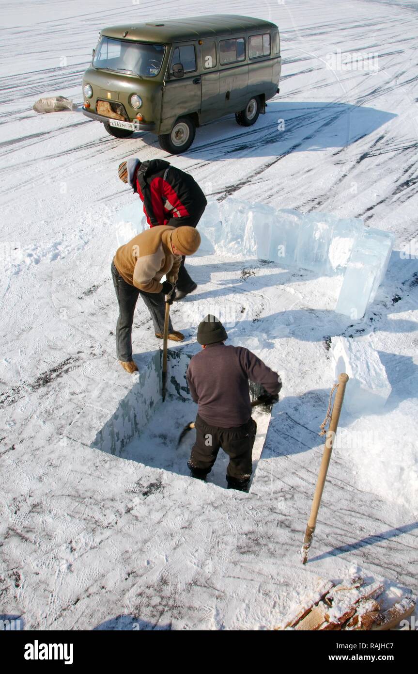 Sawing ice from frozen lake hi-res stock photography and images - Alamy