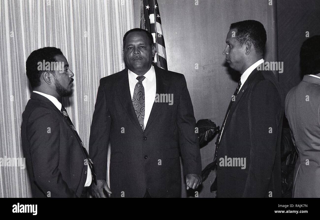 THREE MEN ARE HAVING A CONVERSATION Stock Photo - Alamy