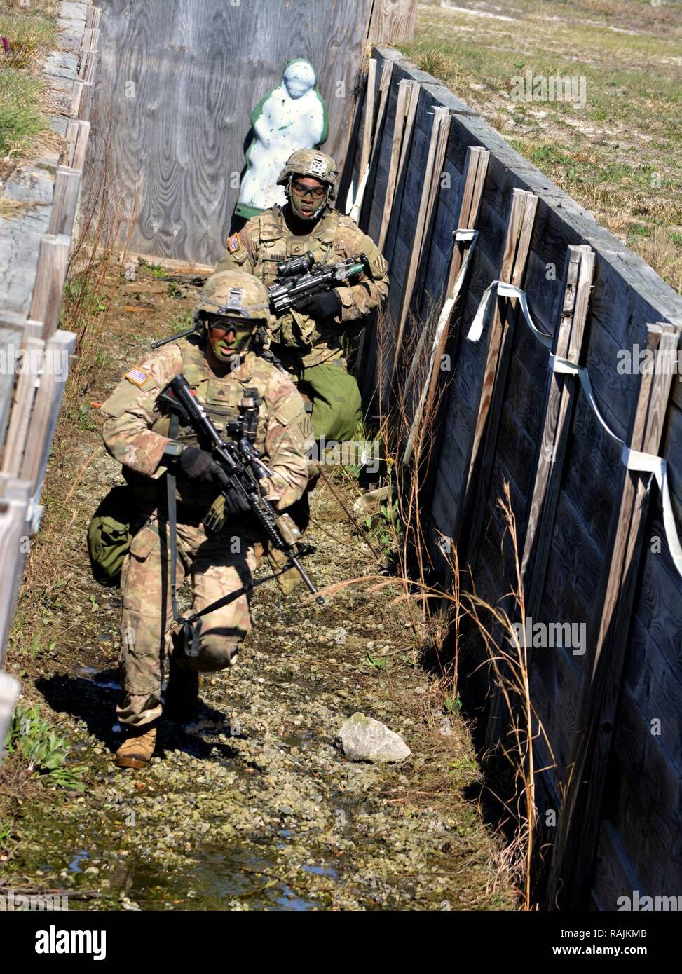 Soldiers from 1st Battalion, 64th Armor Regiment clear a trench during ...