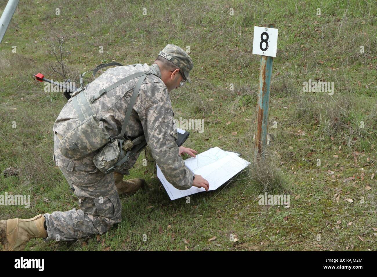 U.S. Army Reserve soldier Sfc. Corey Stevick checks his azimuth at his ...